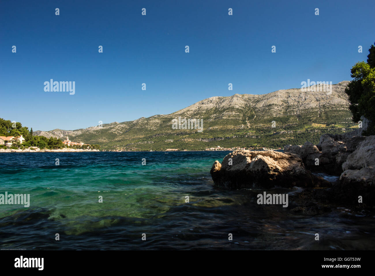 Sea with rocks Stock Photo - Alamy