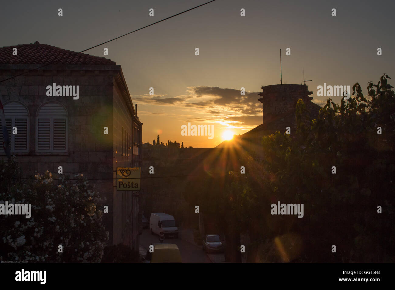Sunset in town Stock Photo - Alamy
