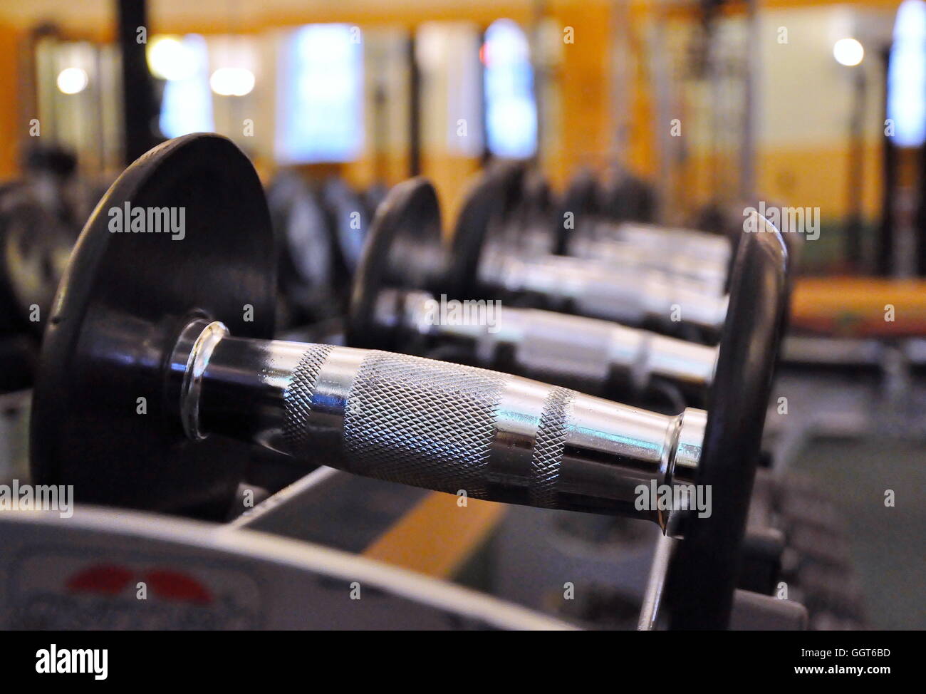Big dumbbell in fitness and gym room interior sport object Stock Photo ...