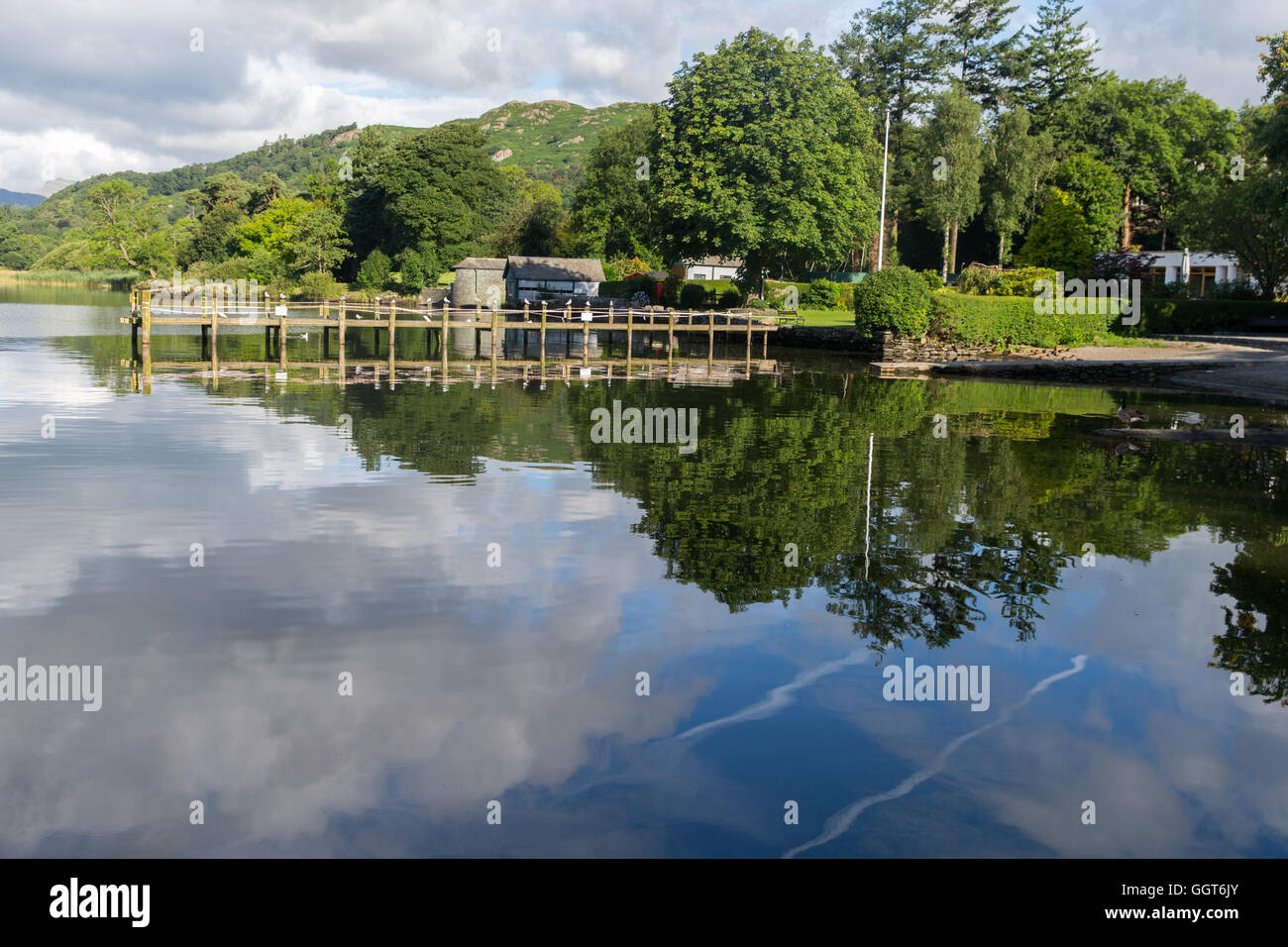 A still calm morning at Waterhead on Lake Windermere near Ambleside ...