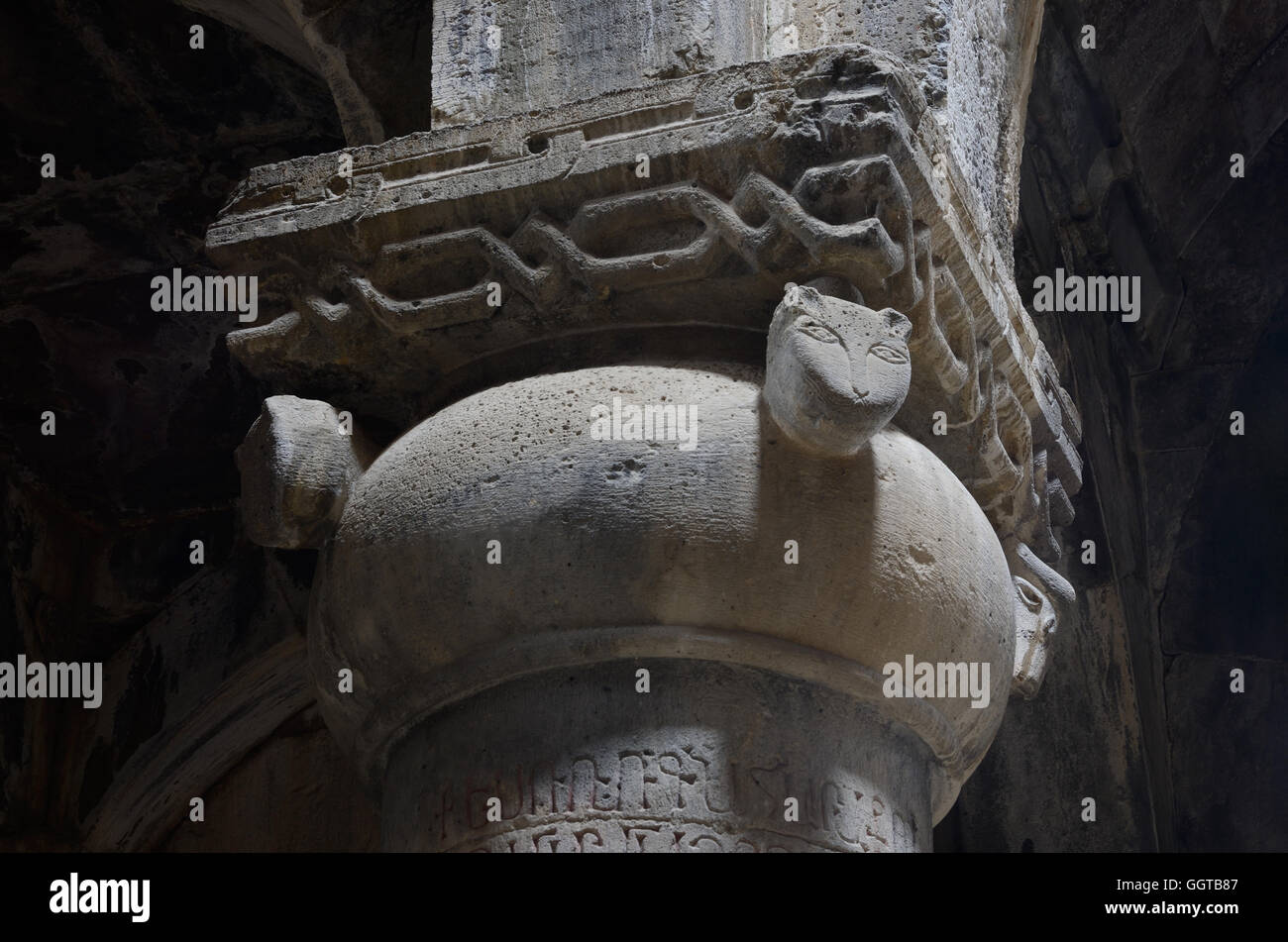 Column with cat heads decoration in medieval christian church of ...