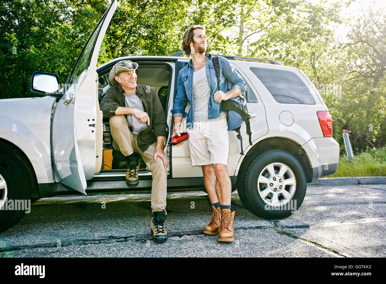 Child standing front of car hi-res stock photography and images - Alamy