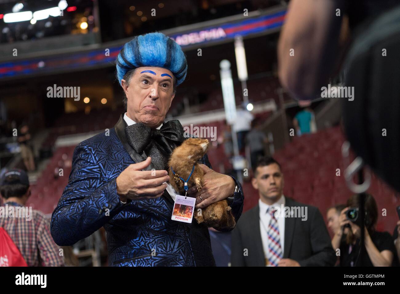 Comedian Stephen Colbert, host of Late Night holds a stuffed weasel ...