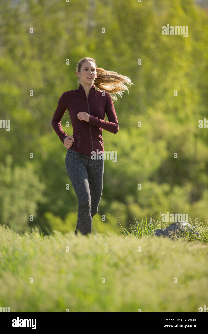 Young woman trail running hi-res stock photography and images - Alamy