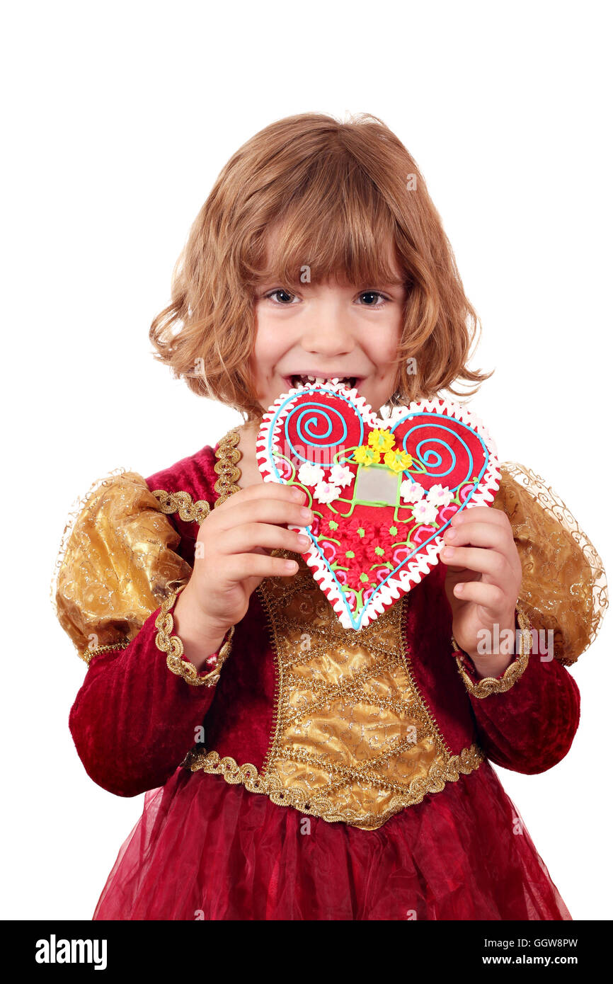 little girl eating gingerbread heart Stock Photo - Alamy