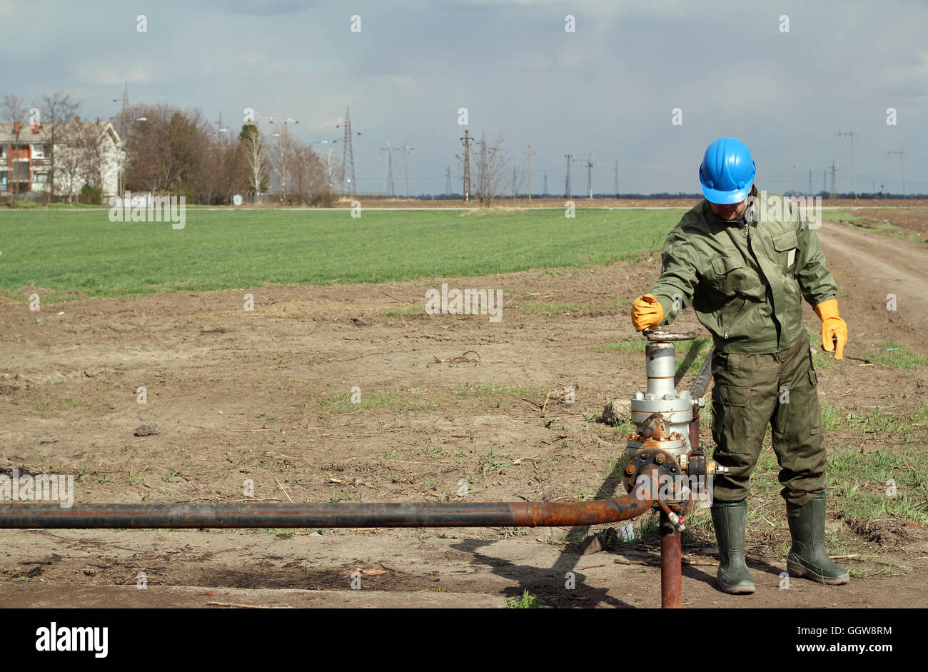 oil worker open pipeline valve Stock Photo - Alamy