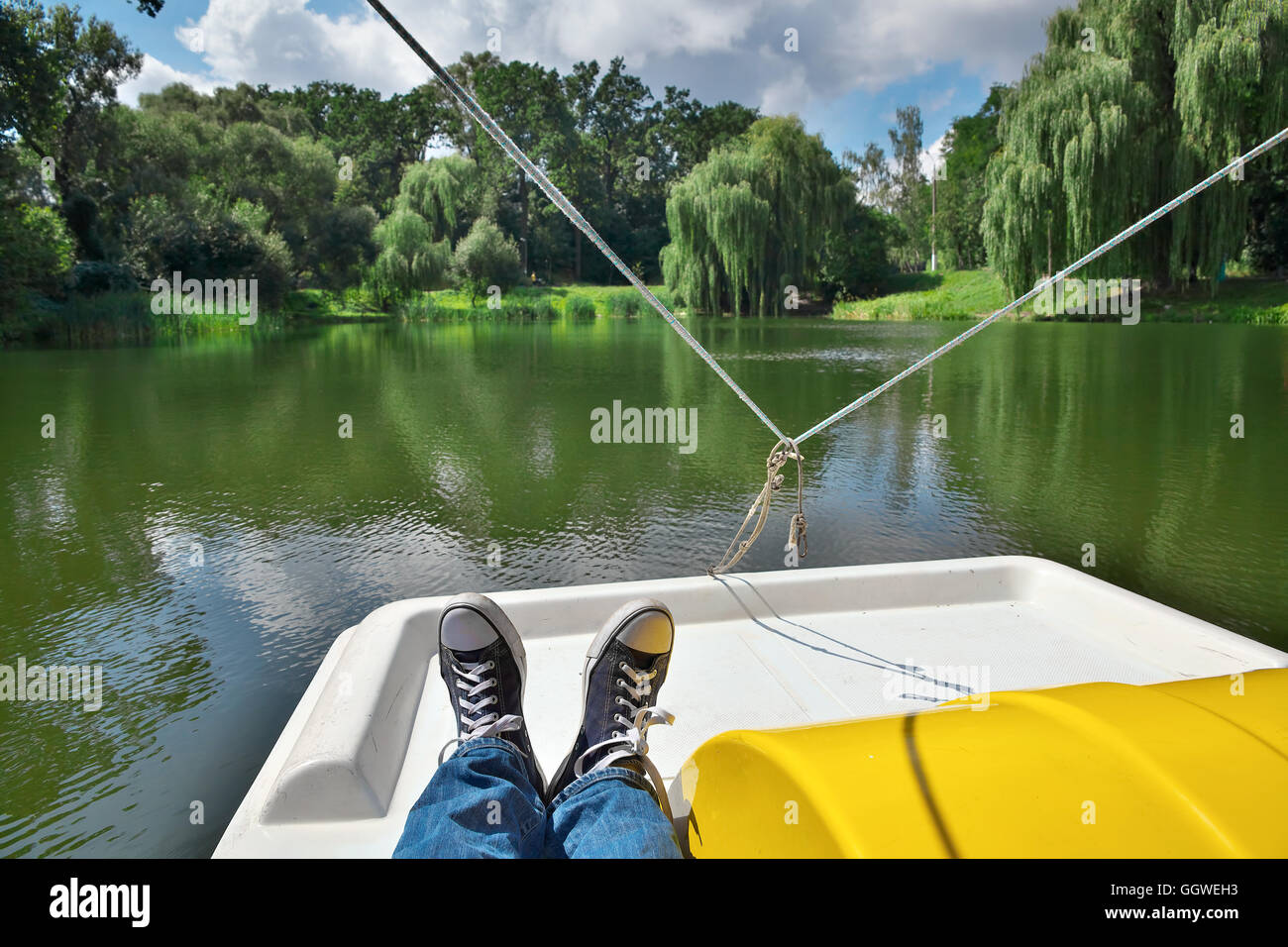 Man having rest on the boat on a lake during a summer day Stock Photo ...