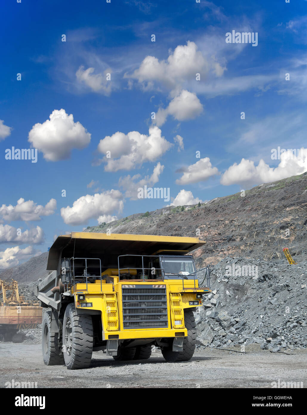 Heavy dump truck transporting iron ore from the opencast Stock Photo ...