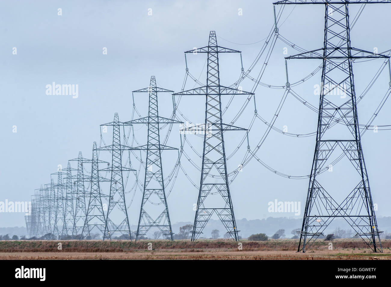 Power pylons and wind turbines in Kent Stock Photo - Alamy