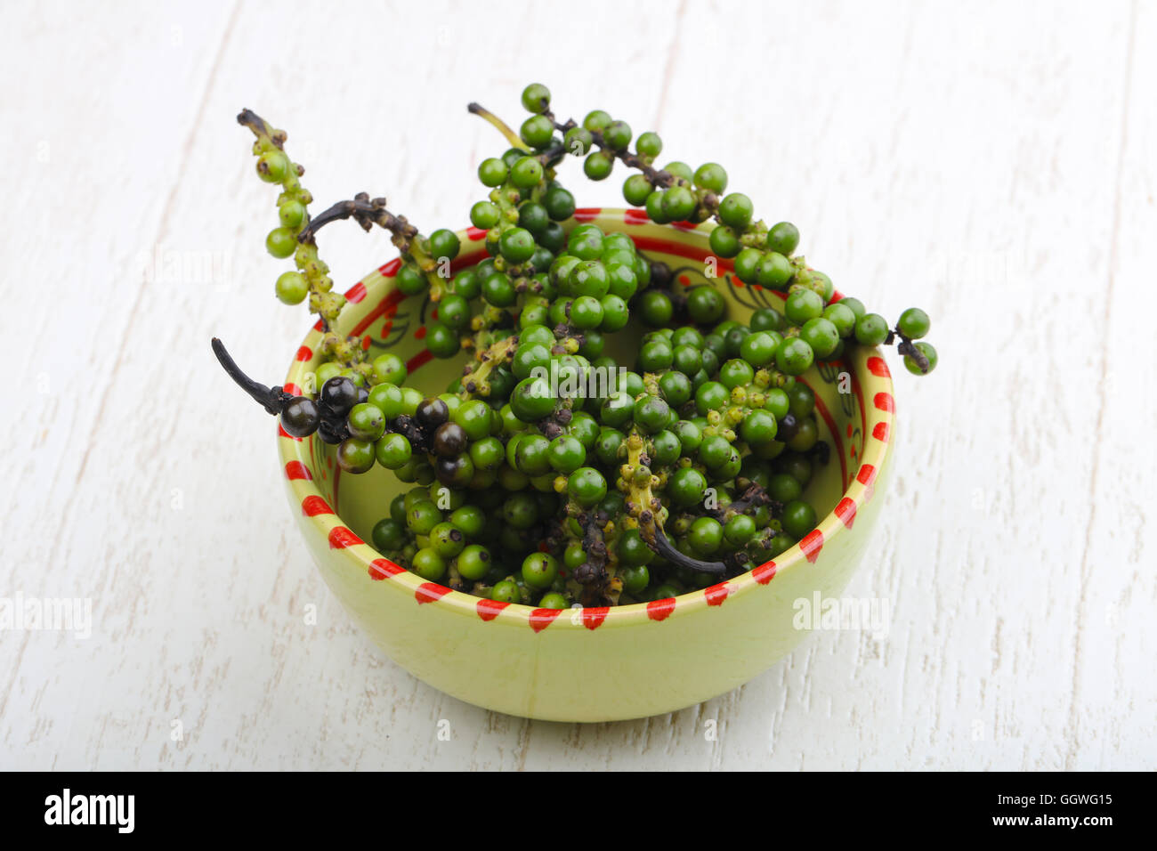 Green pepper corn on the branch in plate Stock Photo - Alamy