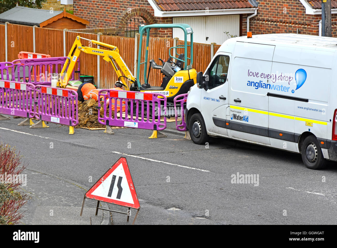Anglian Water crew and van attending street sewer connection from ...