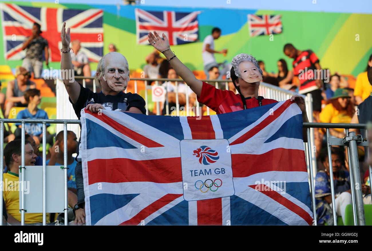 Great Britain fans wear masks of Queen Elizabeth II and Prince Philip ...