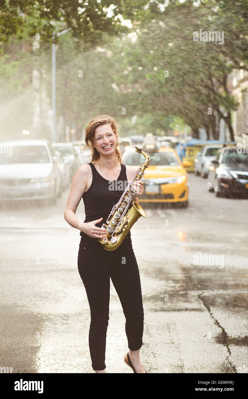 Girl saxophone hi-res stock photography and images - Alamy