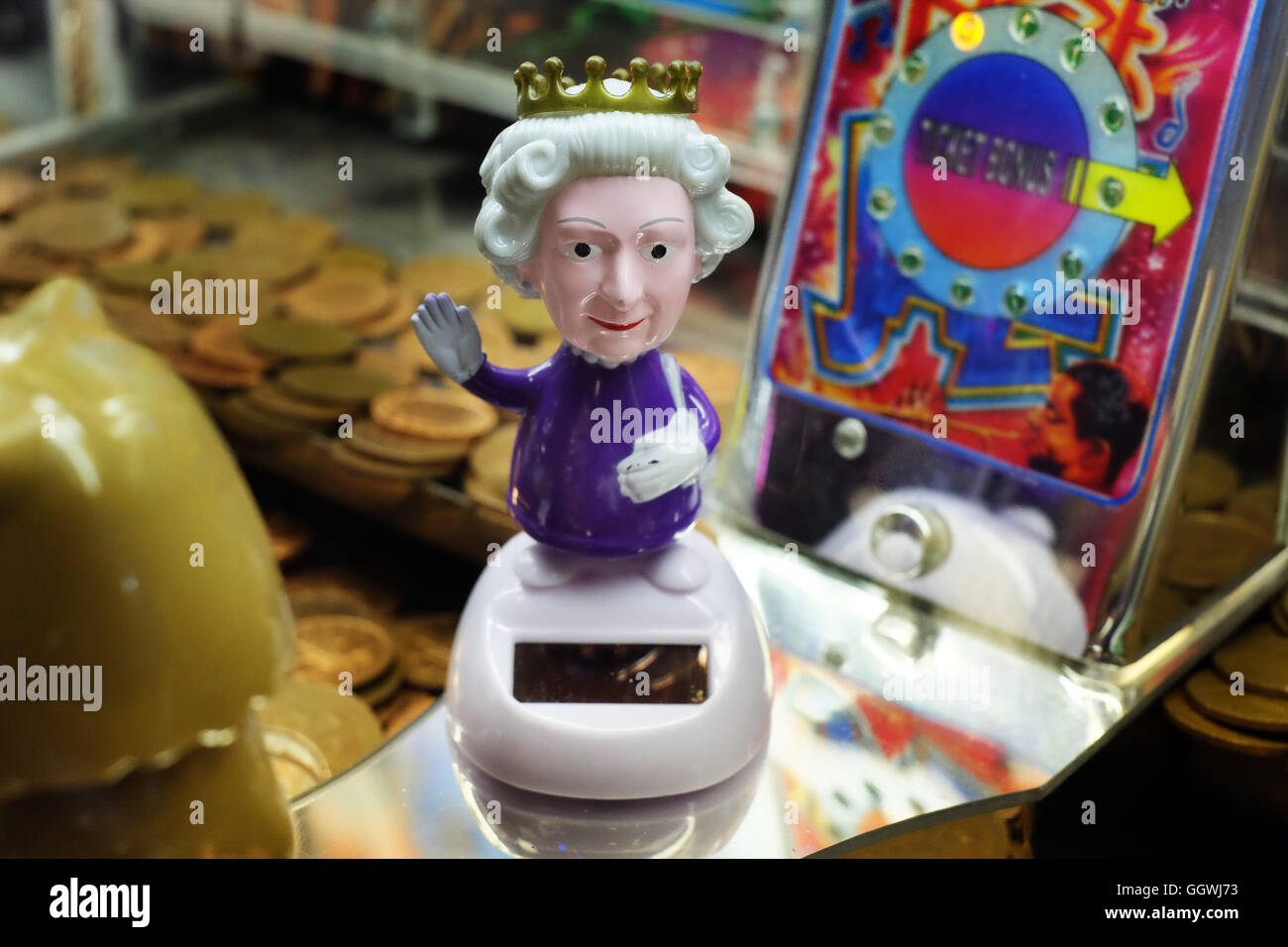 Toy of the UK Queen as prize in amusement arcade machine Stock Photo ...