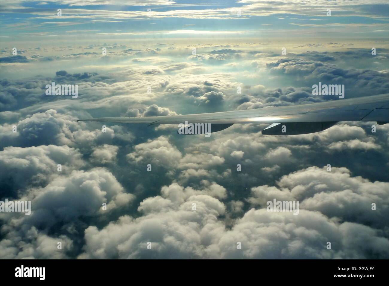 View from plane window of plane wing and clouds Stock Photo - Alamy