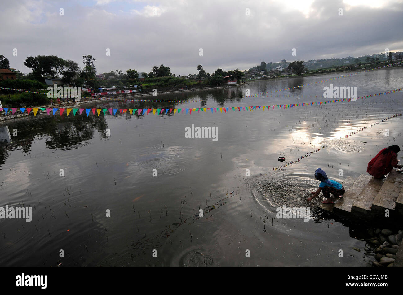 Kathmandu, Nepal. 07th Aug, 2016. A devotee cleans her face during Nag ...
