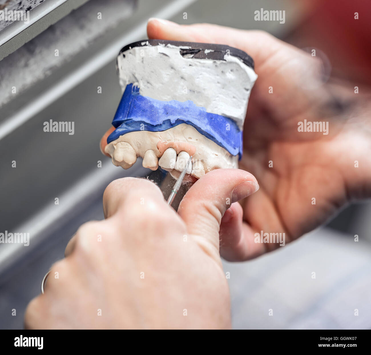 Woman hand make denture with tool Stock Photo - Alamy