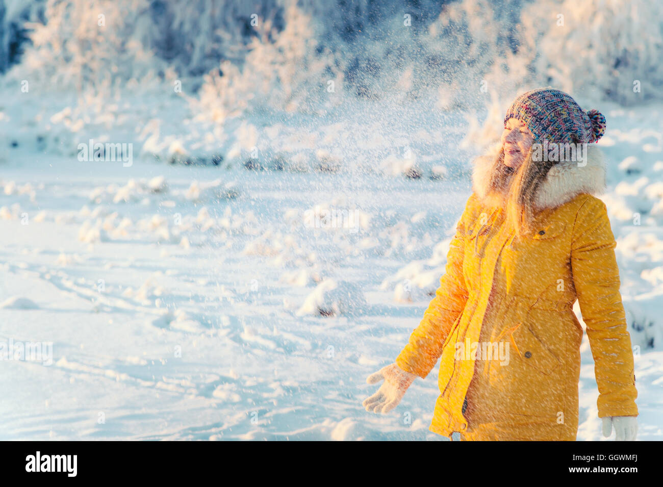 Young Woman playing with snow Outdoor Winter Lifestyle happiness ...