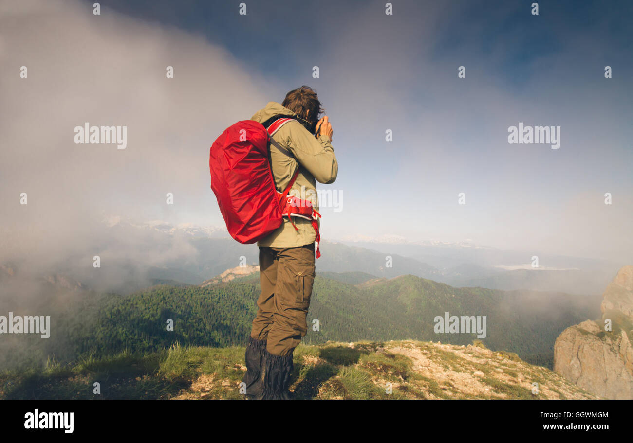 Man Traveler with photo camera and backpack hiking outdoor Travel ...