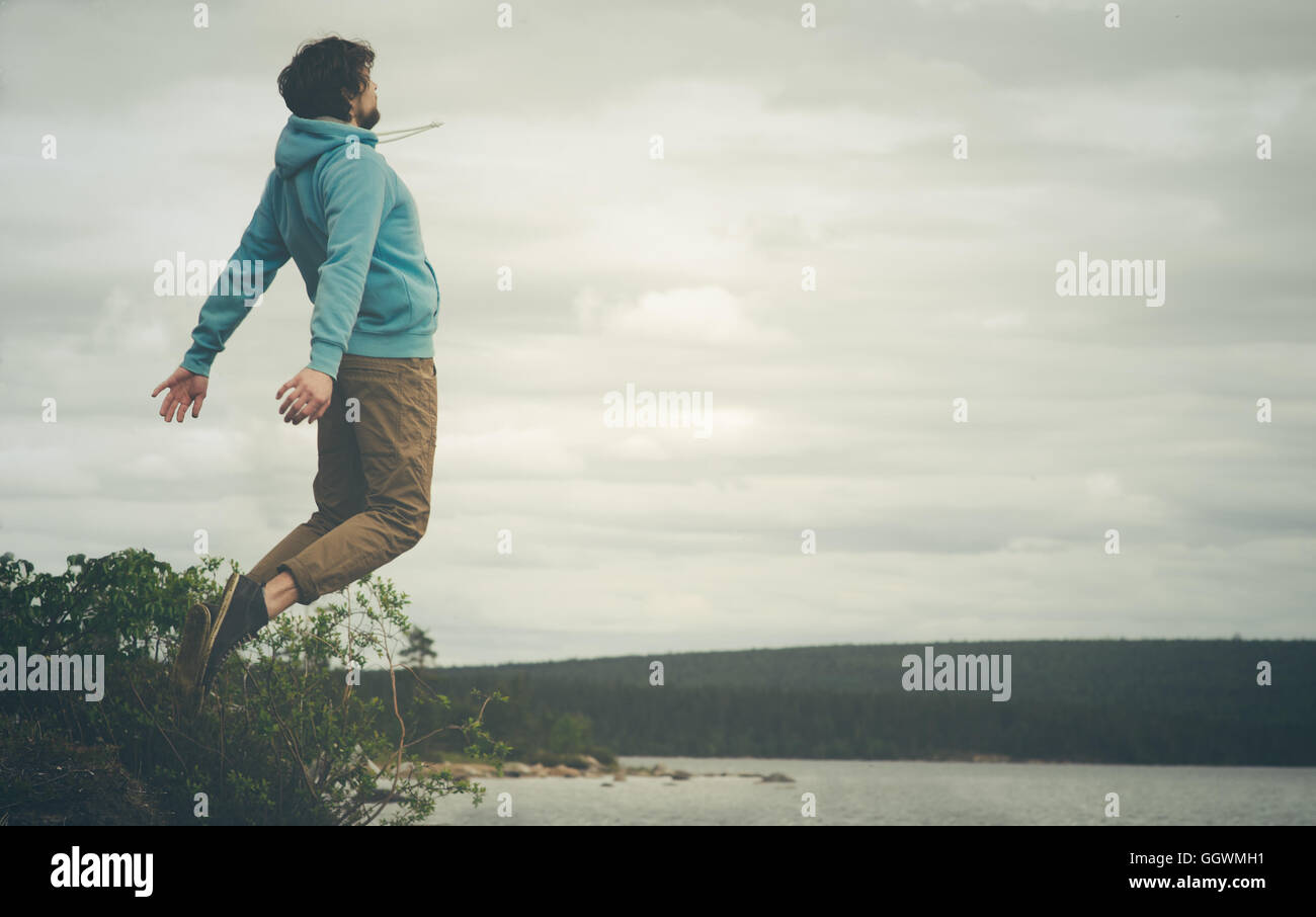 Young man flying levitation jumping hi-res stock photography and images ...