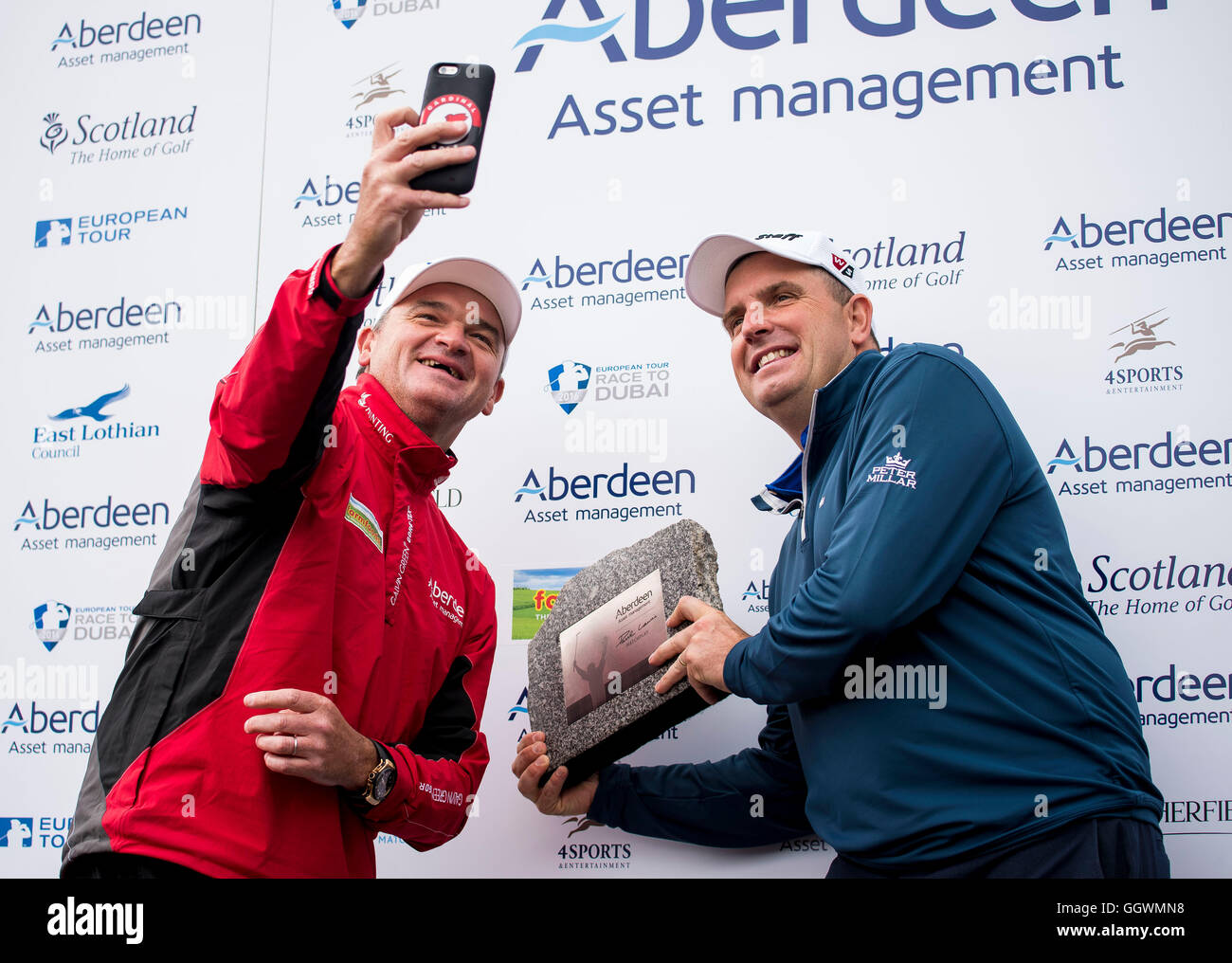 Anthony Wall (right) celebrates with the trophy after winning the Paul ...