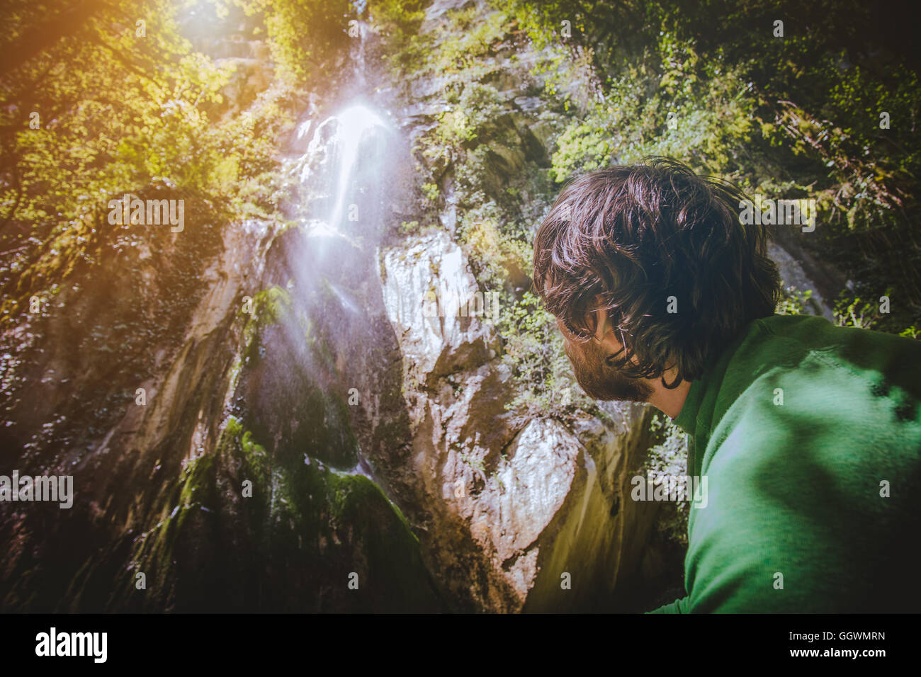 Man Traveler relaxing with waterfall view in mountains Travel Lifestyle ...