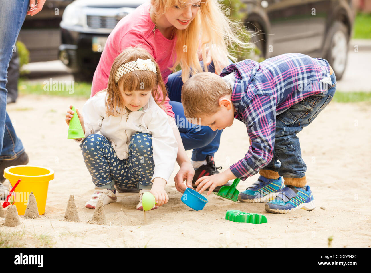 Children playing in a sandbox Stock Photo - Alamy