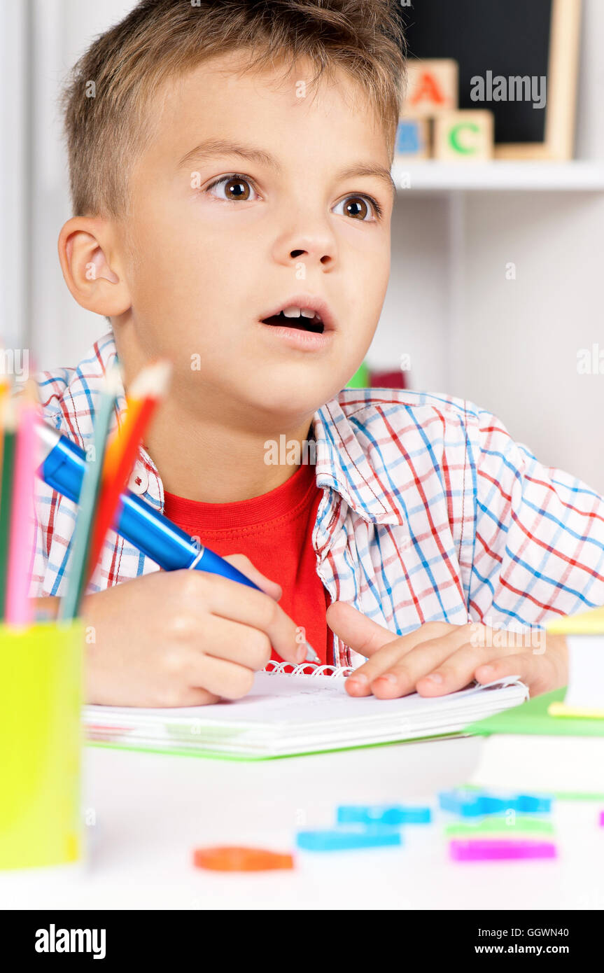 Boy homework at table Stock Photo - Alamy