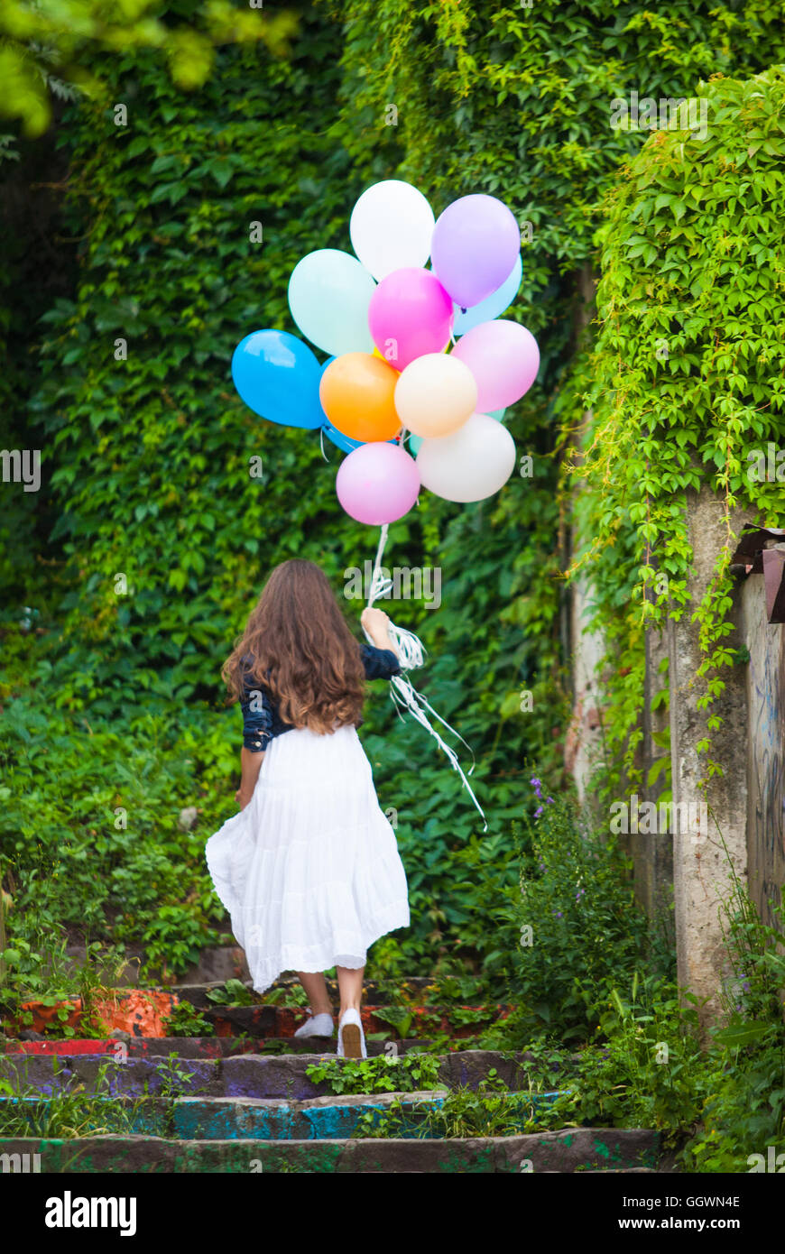 Girl with colorful balloons Stock Photo - Alamy