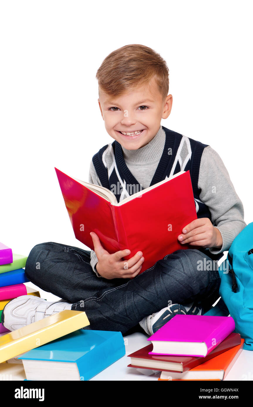 Boy reading book Stock Photo - Alamy