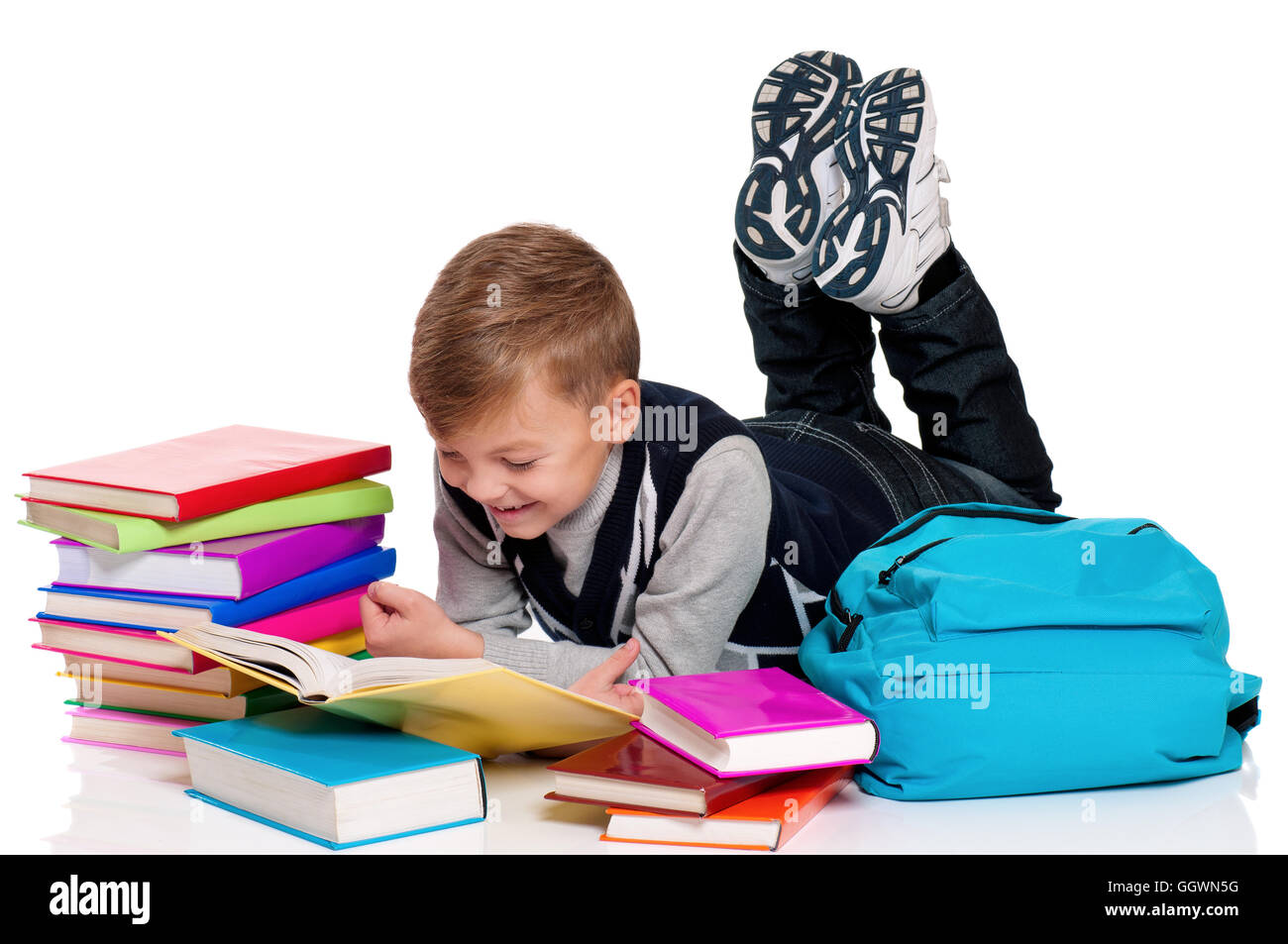 Boy reading book Stock Photo - Alamy