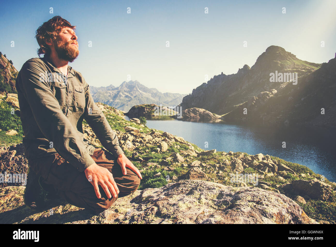 Bearded Man relaxing alone with nature Travel Lifestyle concept lake ...