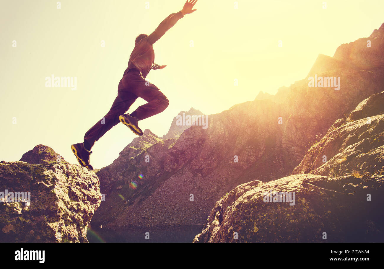 Man running cliff hi-res stock photography and images - Alamy