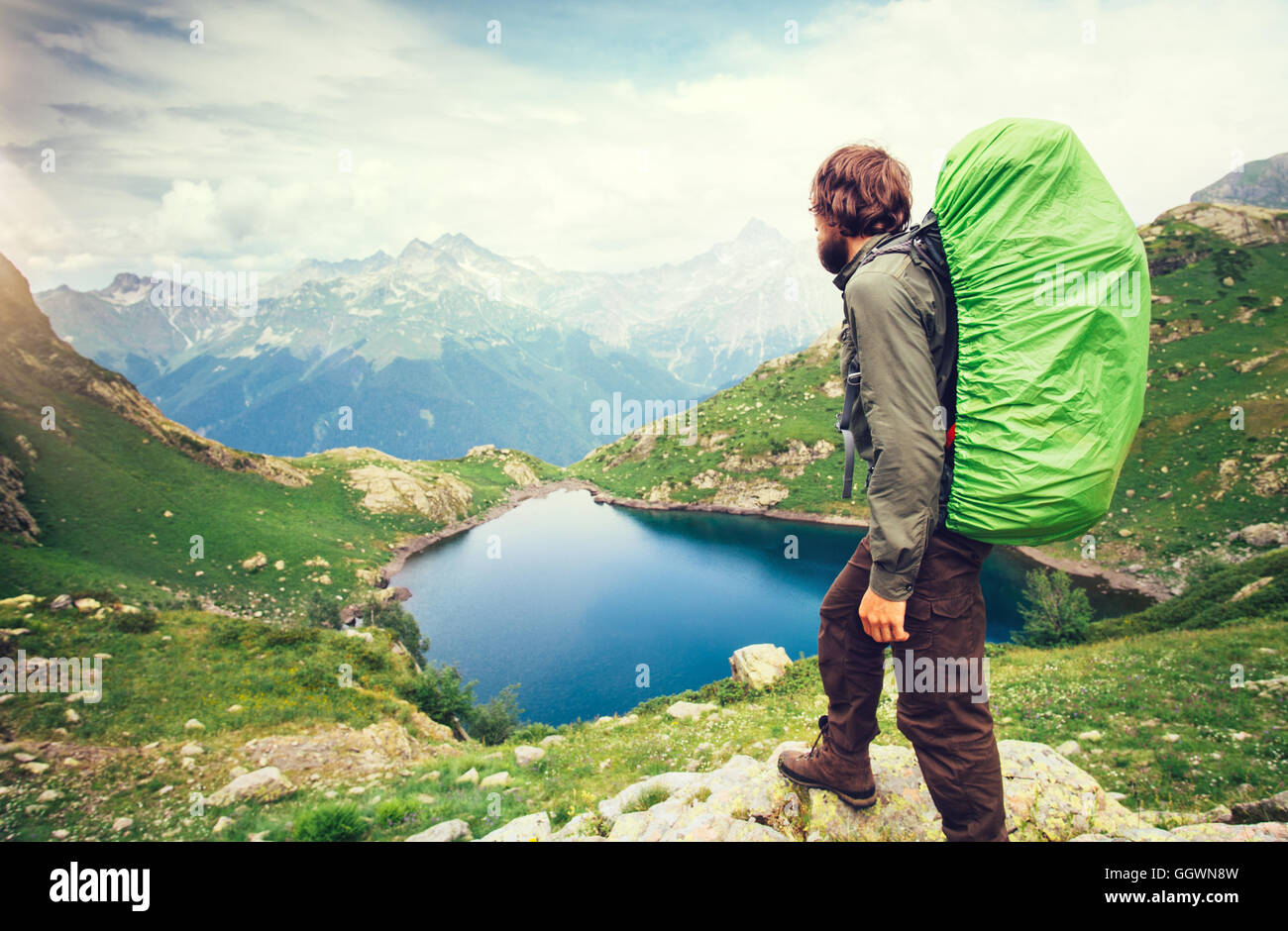 Man Traveler with big backpack hiking Travel Lifestyle concept lake and ...