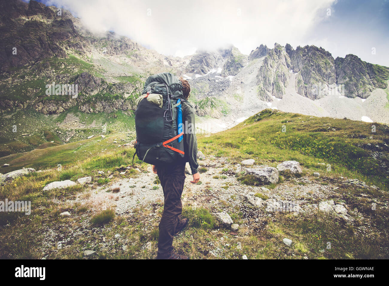 Man Traveler with big backpack hiking Travel Lifestyle concept rocky ...