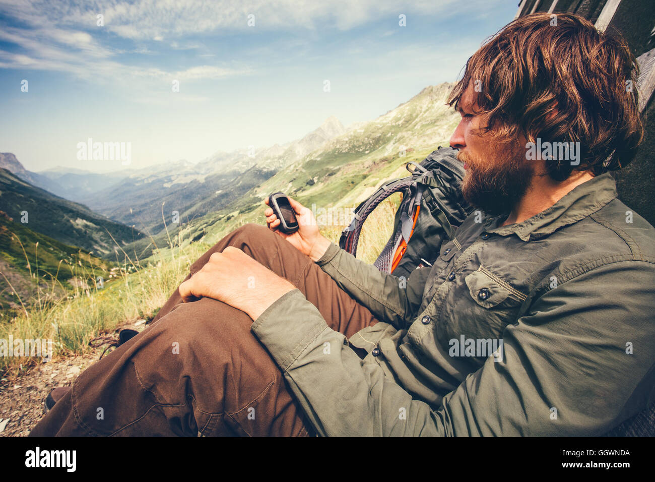 Bearded Man with gps navigator tracker relaxing alone Travel Lifestyle ...