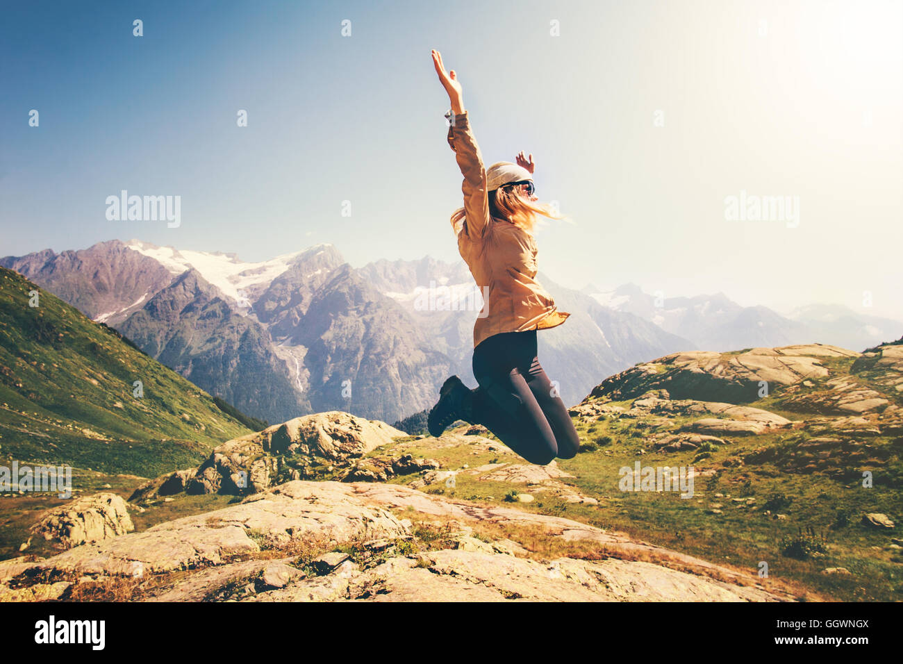 Happy Woman jumping up Flying levitation with mountains landscape on ...