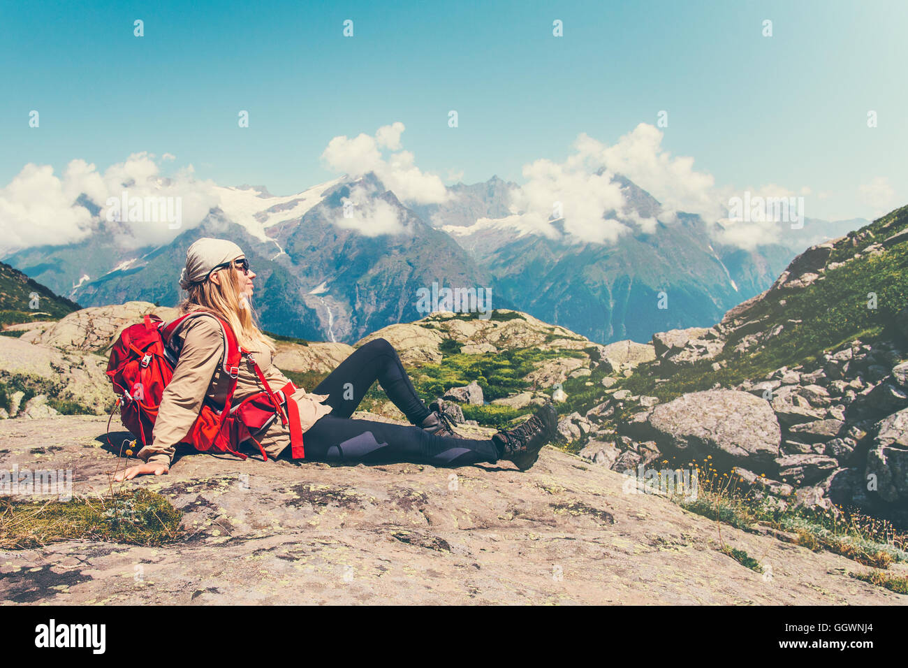 Happy Woman Traveler relaxing sitting mountains serene landscape on ...
