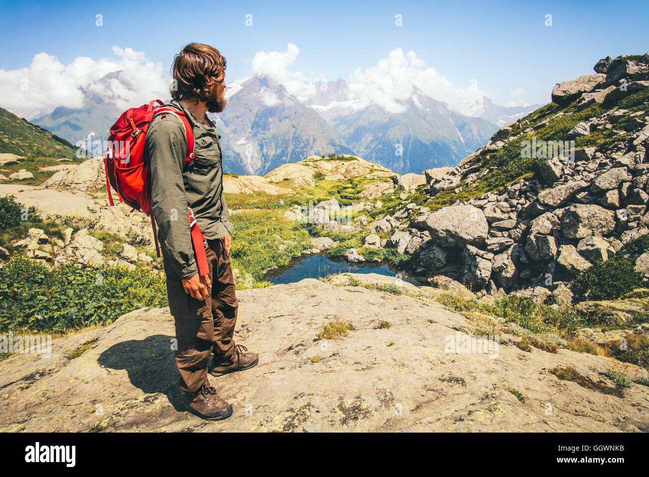Traveler Man with backpack hiking Travel Lifestyle concept mountains ...