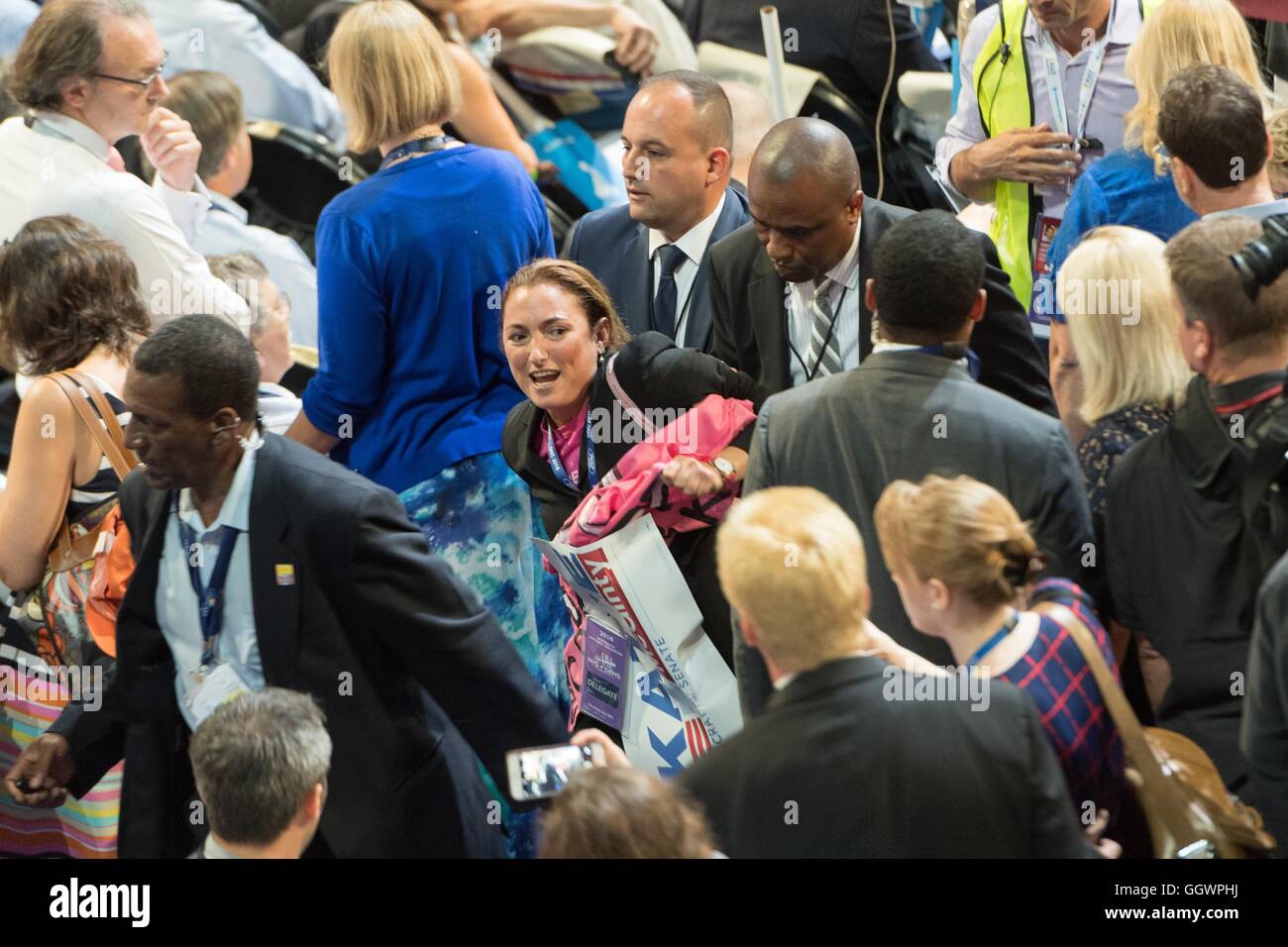 A Code Pink protester holds up a "Boycott Israel" sign as she is ...