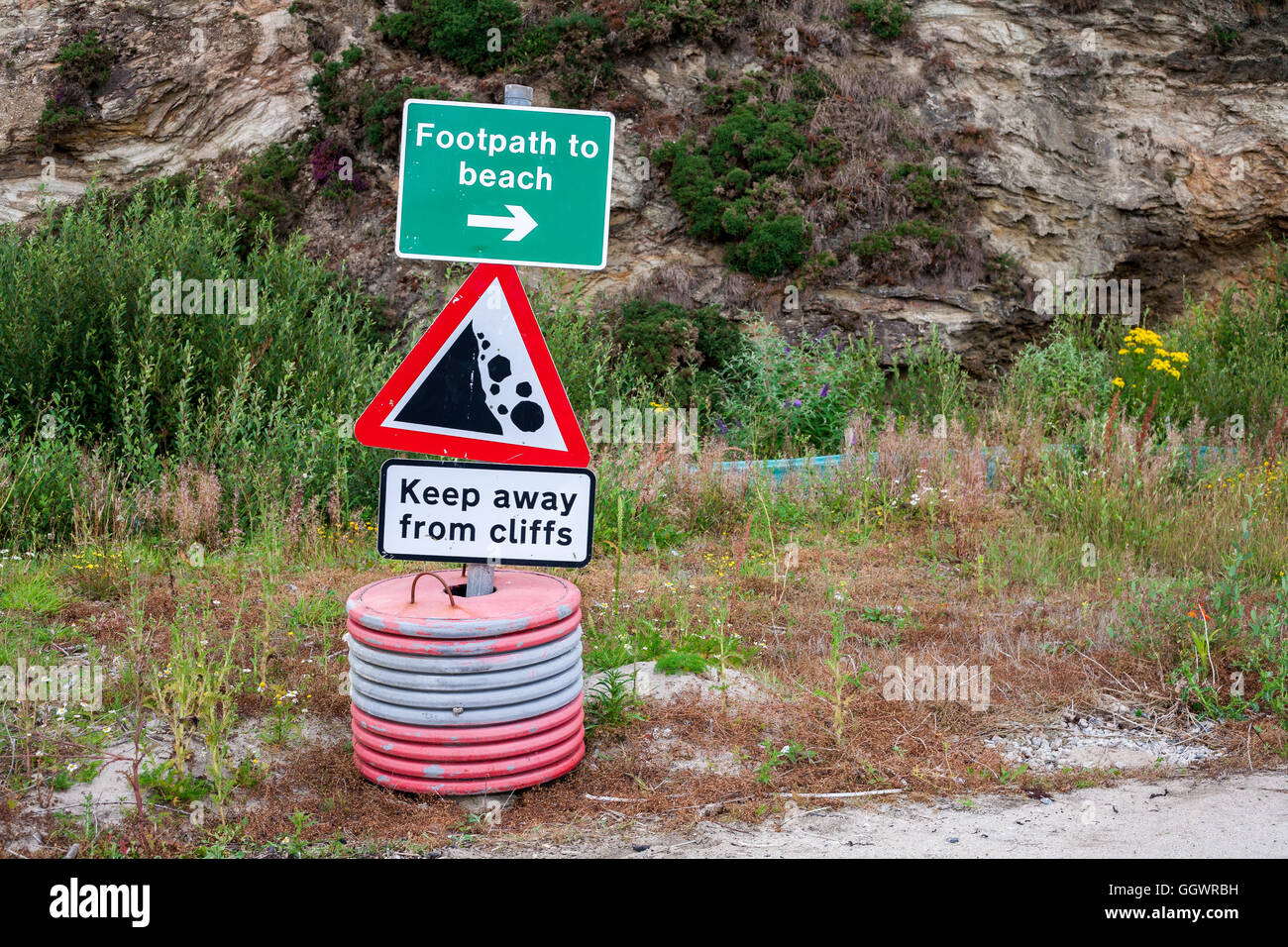 Footpath to Beach Sign. Danger of falling rocks warning. Public notice ...