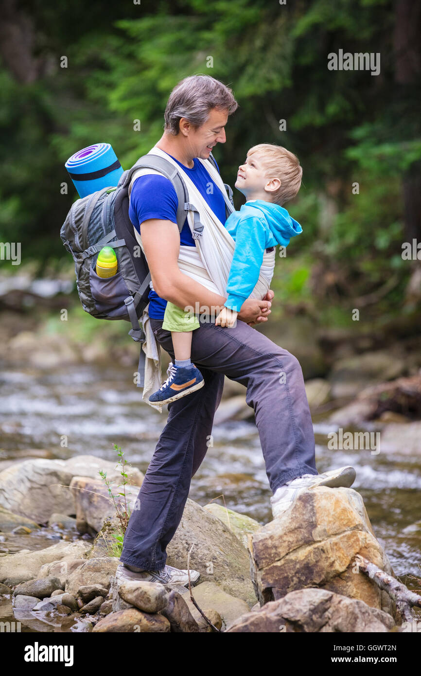 Man carrying boy hi-res stock photography and images - Alamy