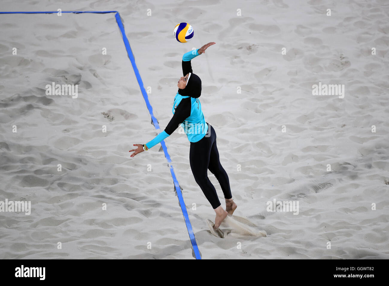 Egypt's Doaa Elghobashy serves during a beach volleyball match at the ...