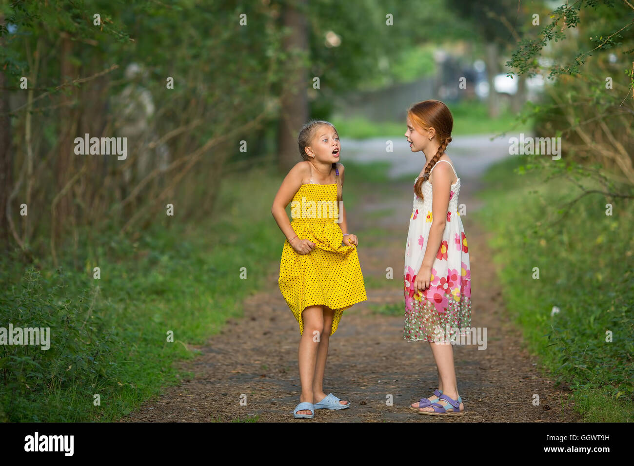 Two children talking hi-res stock photography and images - Alamy