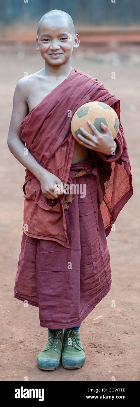 Young Buddhist Monk with Ball Stock Photo - Alamy