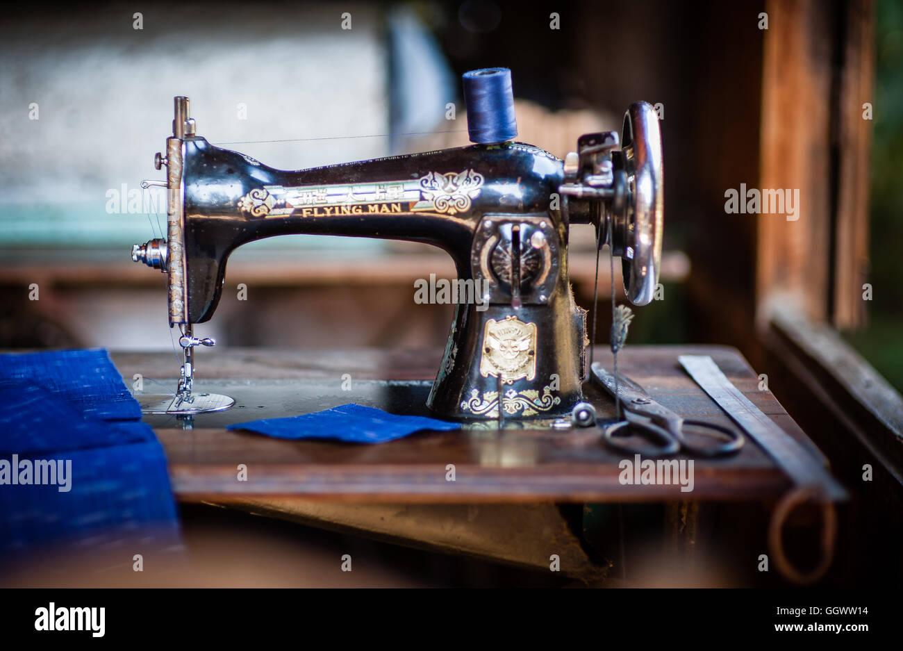 Old Flying Man Sewing Machine Stock Photo - Alamy