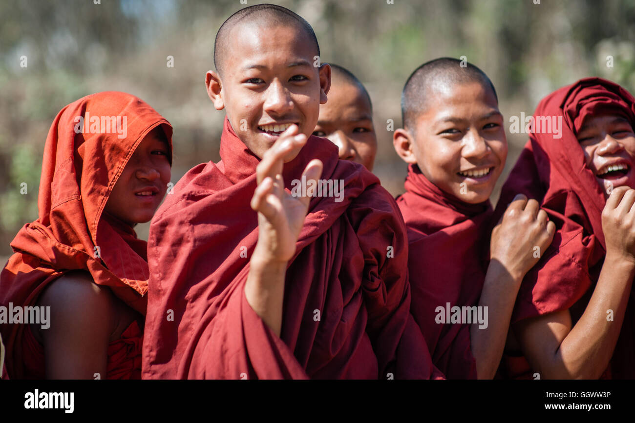Asia buddhist kids maroon monks smile smiling wrapped young heads hi ...