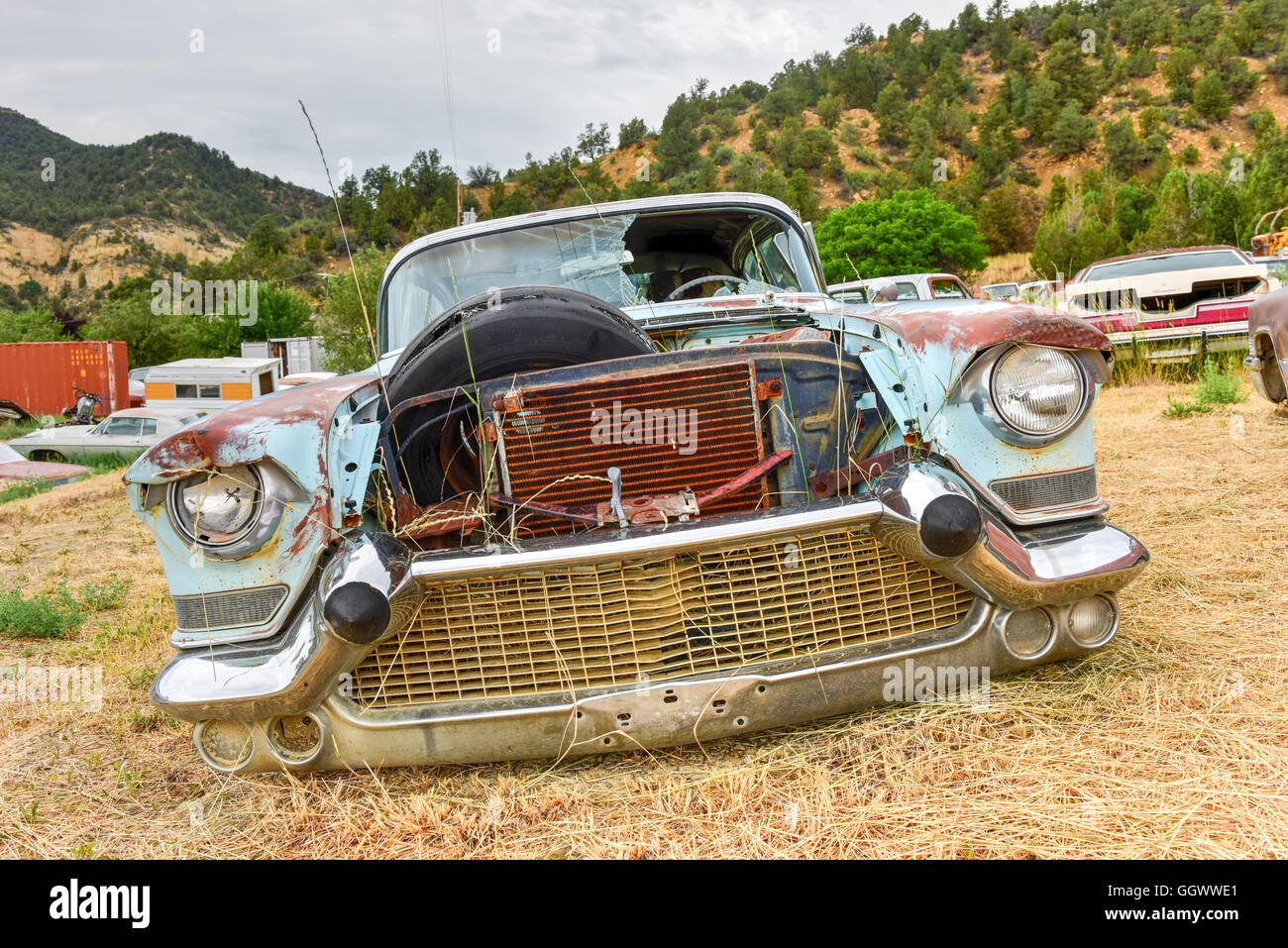 Rusting old car in a desert junk yard Stock Photo - Alamy