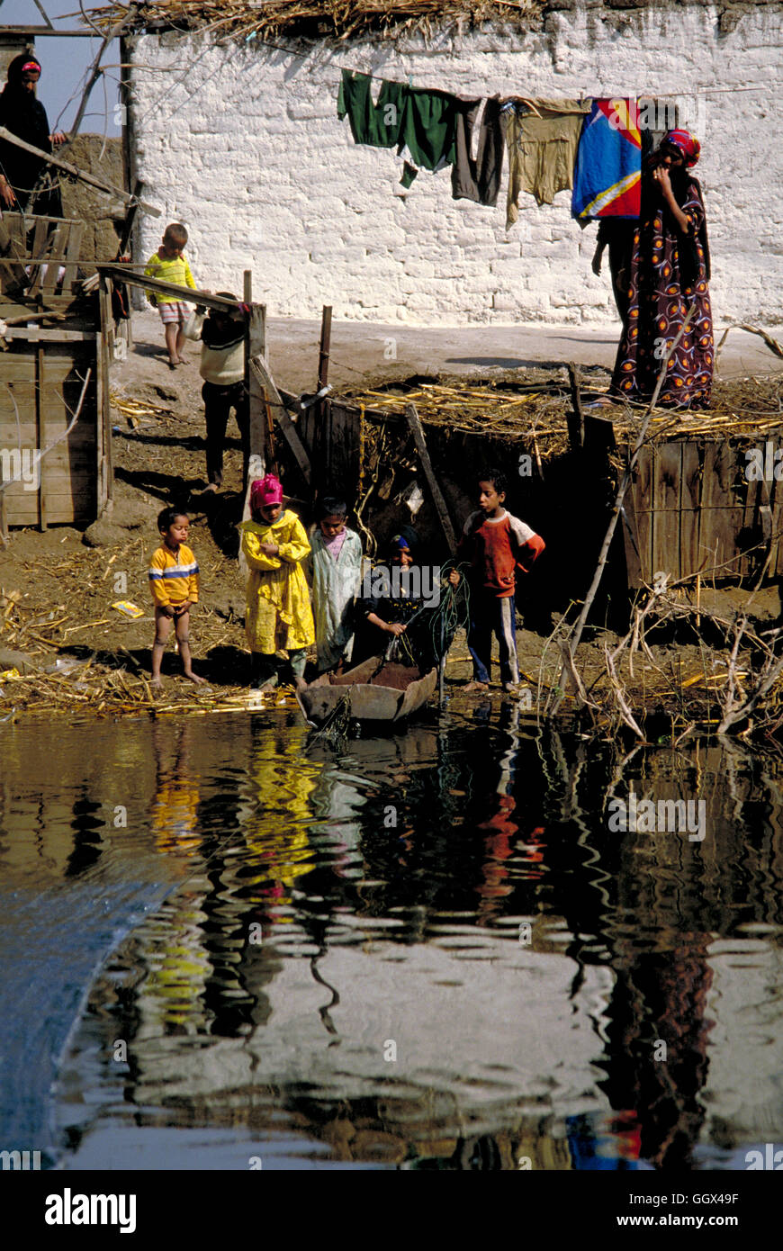 A day in the life of ordinary Egyptians. A woman does her wash in a ...