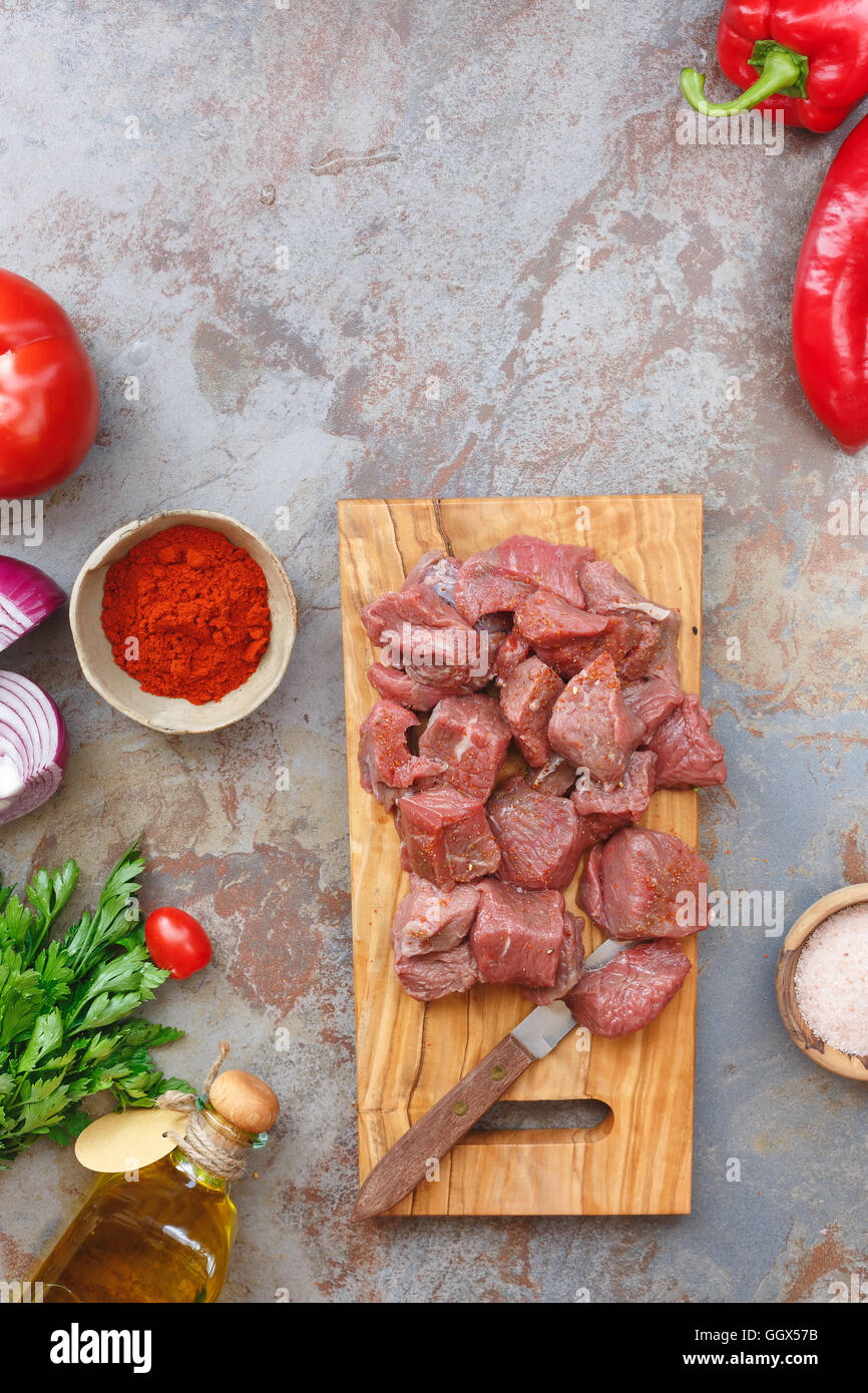 Chopped raw meat with vegetables and herbs, ready to cook, Top view ...